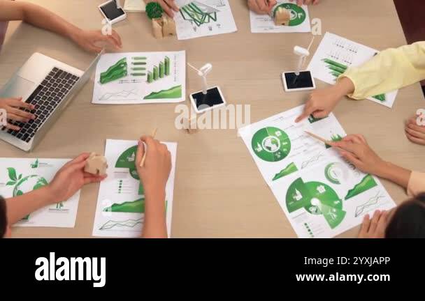 Excellent business team discussing on eco house project at meeting ...