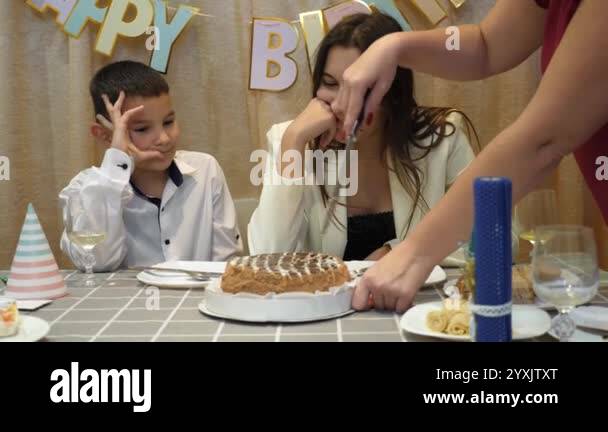 People celebrating a birthday are eating a birthday cake. Cake is an ...