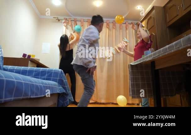 Celebrating a child's birthday, people dance, play and have fun ...