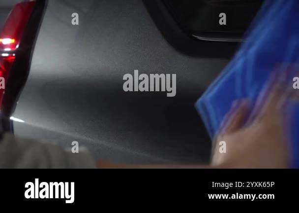 Cleaner worker dry body car after washing automobile 4k video. Hand car ...