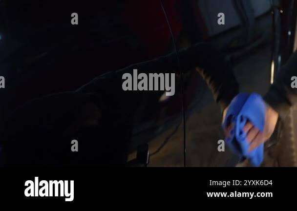 Cleaner worker dry body car after washing automobile 4k video. Hand car ...