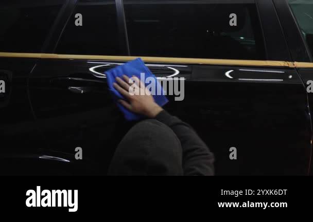 Polishing body car using a microfiber rag in detailing service. Process ...