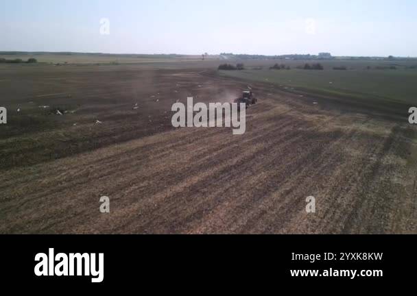 Big Tractor Working on Field with Cultivator Stock Video Footage - Alamy