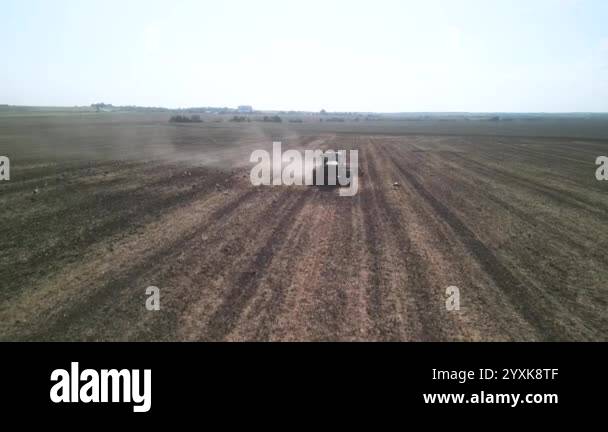 Big Tractor Working on Field with Cultivator Stock Video Footage - Alamy