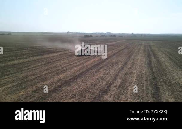 Big Tractor Working on Field with Cultivator Stock Video Footage - Alamy