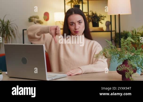 Dislike. Upset unhappy Caucasian woman showing thumbs down sign gesture, expressing discontent ...