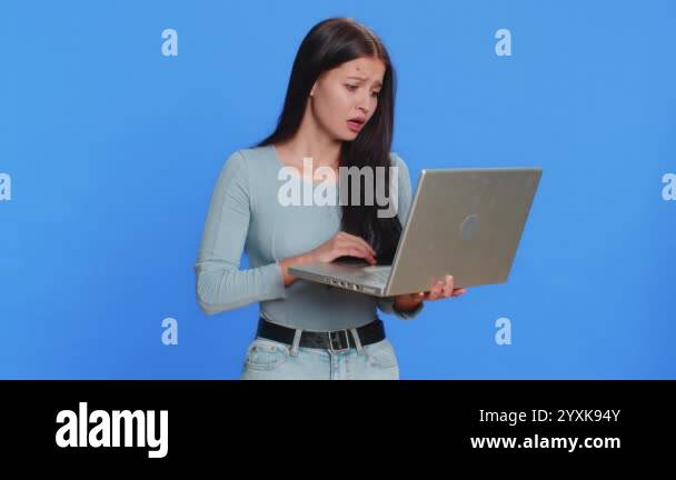 Displeased Caucasian woman use laptop notebook typing browsing working ...
