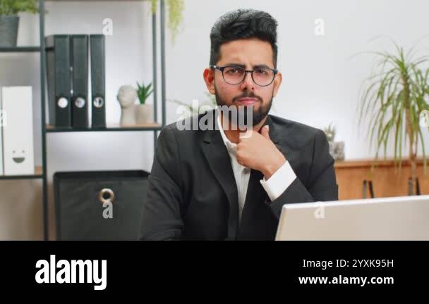 Displeased upset Indian businessman freelancer reacting to unpleasant ...