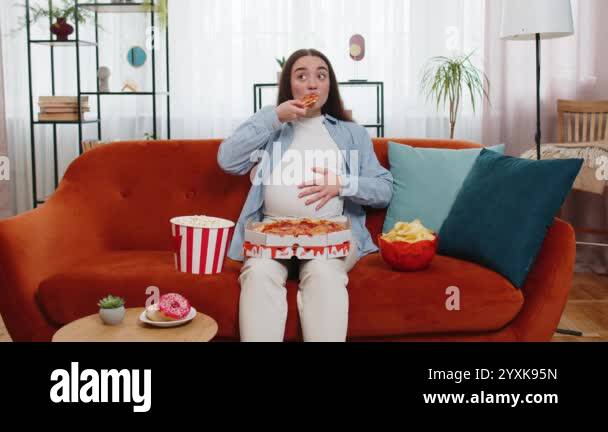 Pregnant Woman Eating Unhealthy Junk Food Pizza Popcorn Crisp Sitting