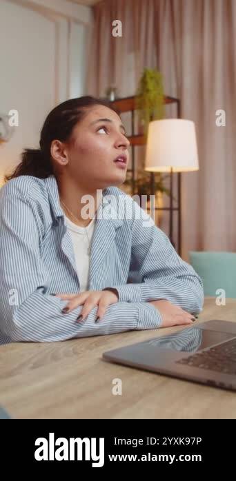 Sad Indian woman looks pensive thinks over life concerns or unrequited ...