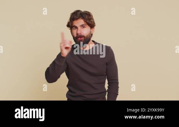 Lebanese man shakes finger, dislike and saying No, be careful, scolding ...