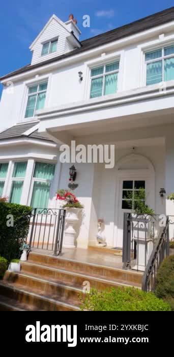 A stunning white residence located in the mountains, offering a blend ...