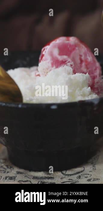 A creamy and sweet ice cream dessert topped with delectable flavors. A ...