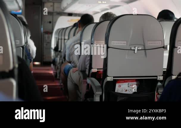 view inside airplane aircraft through aisle pathway on the plane to ...