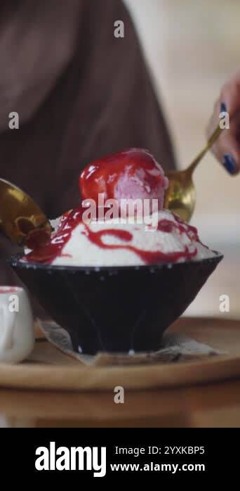 A creamy and sweet ice cream dessert topped with delectable flavors. A ...