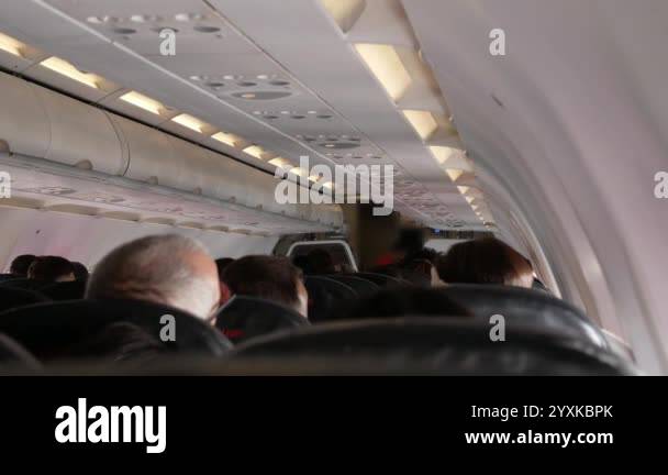 view inside airplane aircraft through aisle pathway on the plane to ...