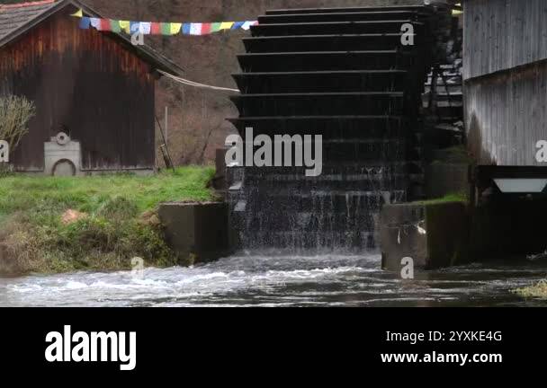 Wooden Mill Wheel Spinning in Slow Motion, Splashing Water Streams on a ...