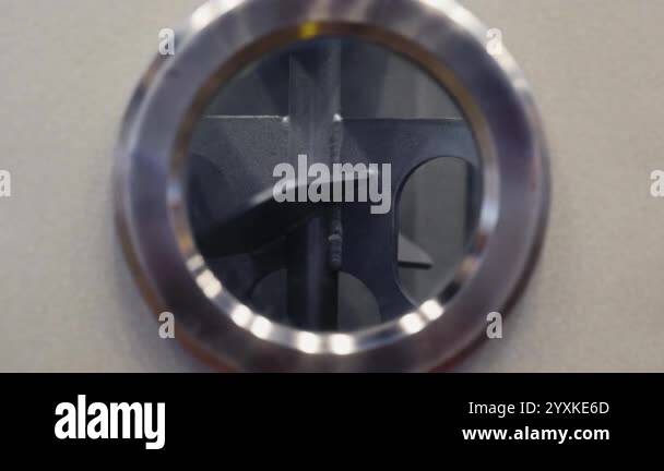 Metal component rotates in cylindrical lock mechanism. Metallic object ...