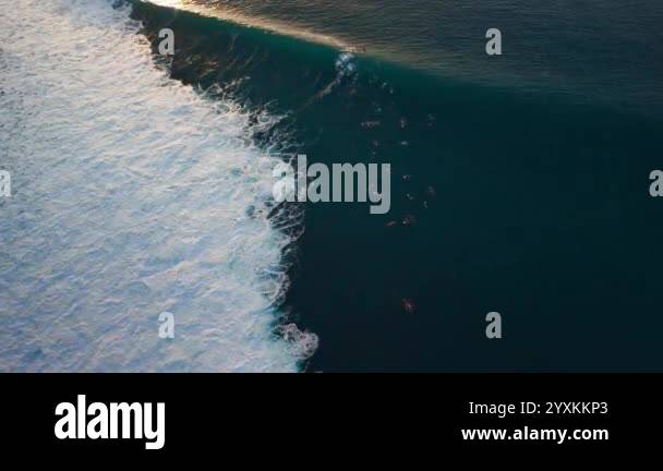 Crashing ocean waves with surfers, aerial view. Breaking surfing waves ...