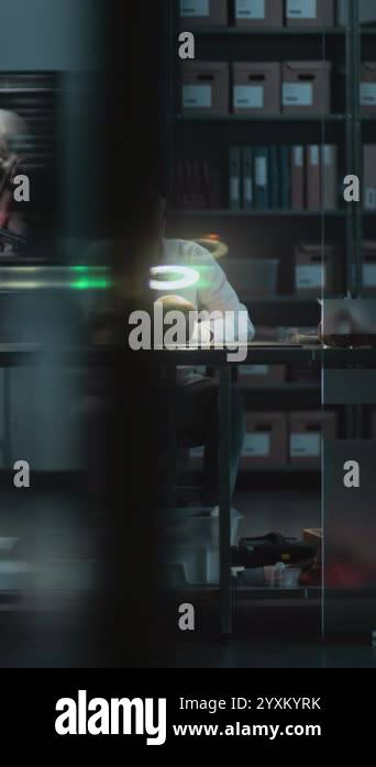 Vertical shot of archaeologist examining fossil skull remains of ...