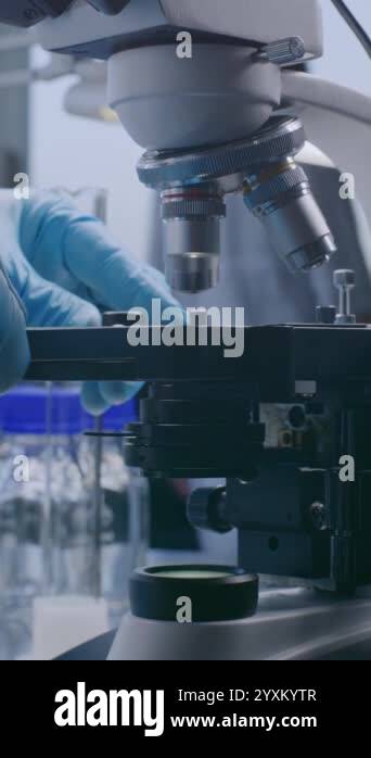 Vertical shot of professional microbiologist or scientist in gloves ...