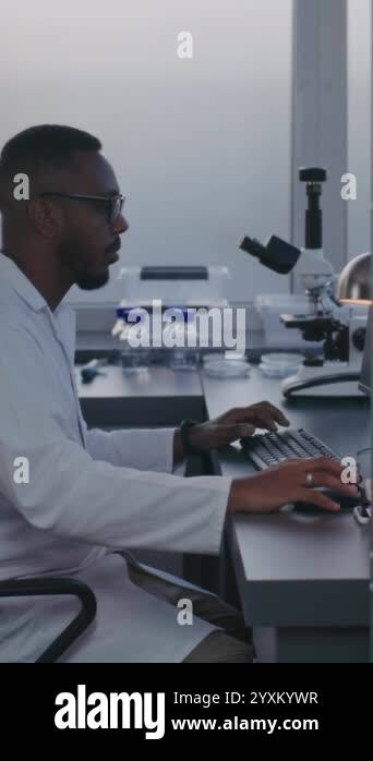 Medical science lab with African American professional biotechnology ...