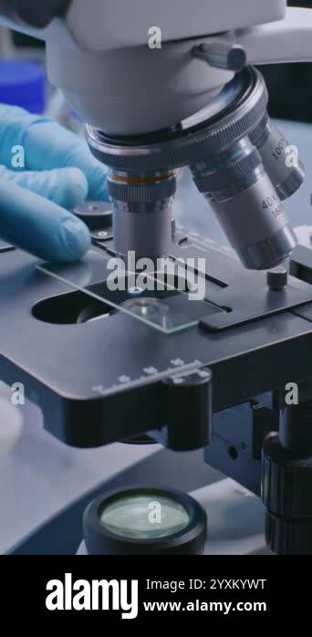 Vertical shot of professional microbiologist or scientist in gloves ...