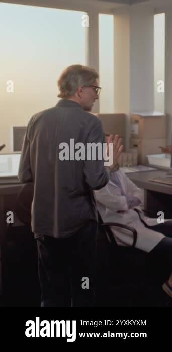 Male and female archaeologists talk, conduct historical research using ...