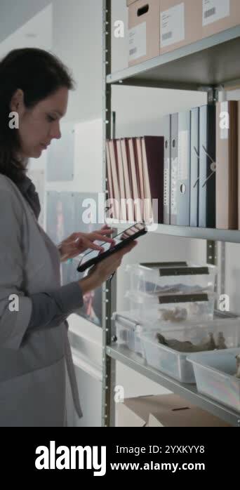 Modern archaeological science lab: Female scientist in lab coat comes ...