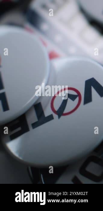Vertical shot of patriotic badges with American flag logo and ...