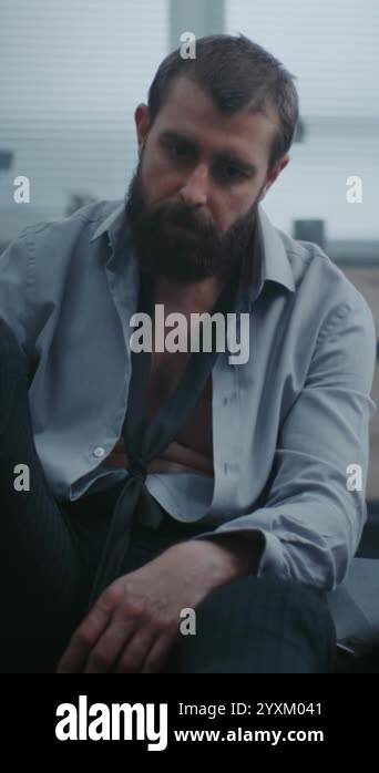 Depressed businessman sits on the floor after fit of rage over ...