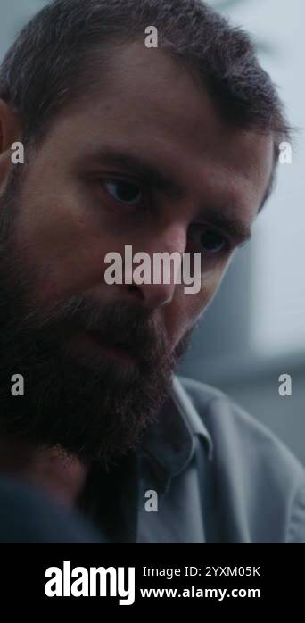 Vertical shot of frustrated office worker sitting on the floor ...