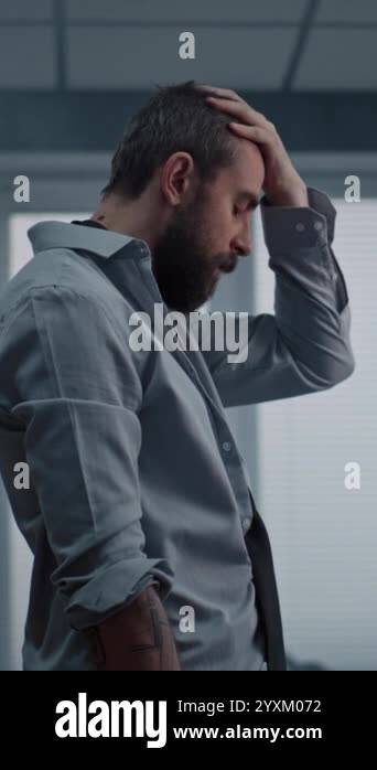 Frustrated and nervous office worker stands, breathes heavily after ...