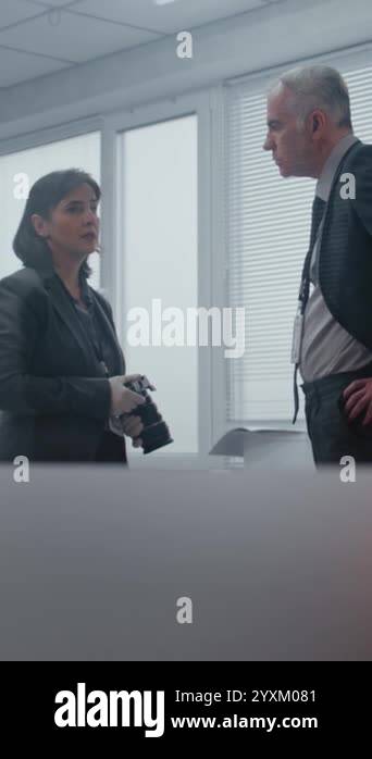 Office robbery case: Female criminalist with professional camera ...