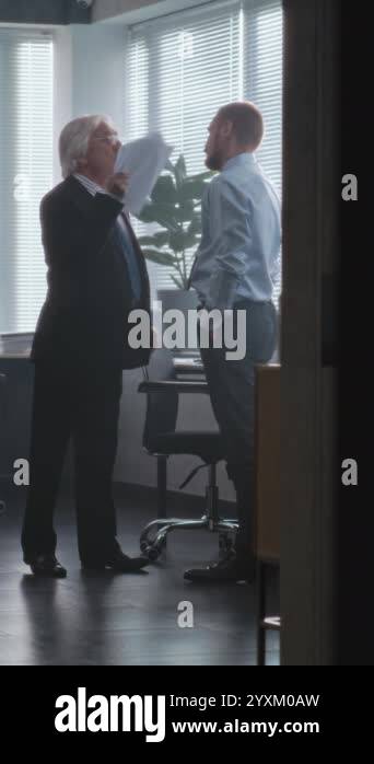 In modern office of bank: Irritated, angry boss having fight with male ...