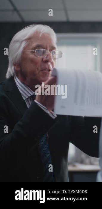 Vertical shot Angry boss having fight with male company employee over ...