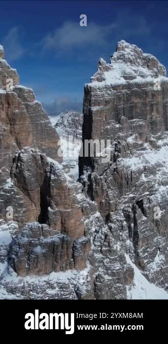 Explore stunning snowy peaks in the Alps, showcasing towering cliffs ...