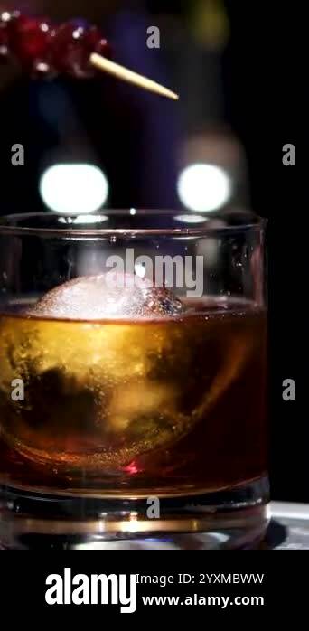 Hands, bartender and lemon in cocktail for drink preparation, beverage ...