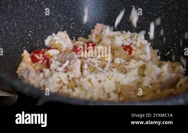 sprinkle parmesan cheese over pasta in a frying pan Carbonara recipe ...