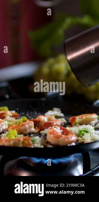 Seafood meal recipe. Seasoning and spicing food. Chef adding pepper to ...