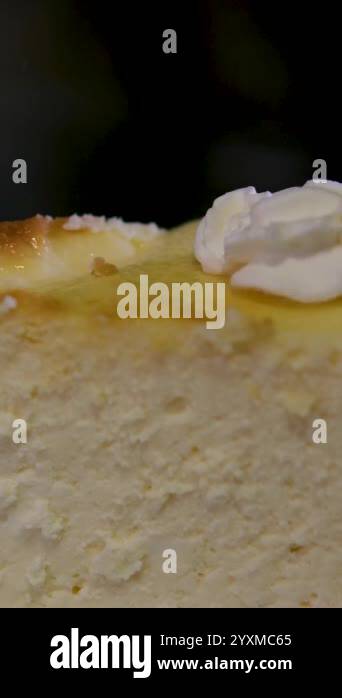 Chef cooking and serving dessert. Pouring whipped cream on cake. Sweet ...