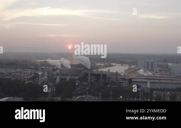 Aerial view Drone shot of flying around toxic chimneys tubing. Air ...