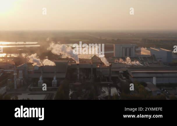 Aerial view Drone shot of flying around toxic chimneys tubing. Air ...