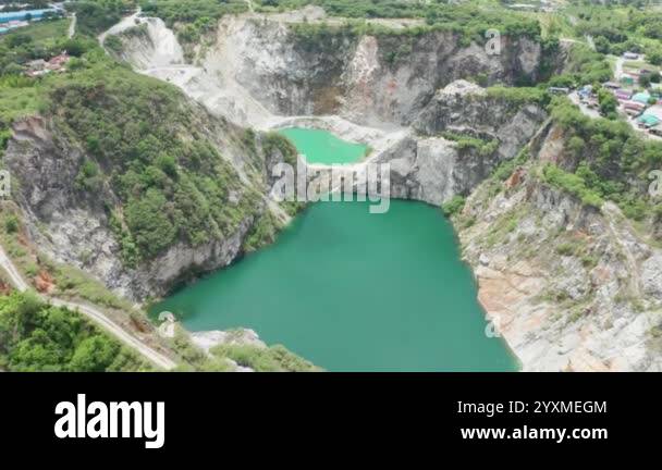 Grand Canyon Chonburi. Trucks dig coal mining of ore with black grunge ...