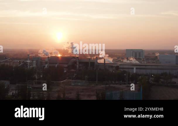 Aerial view Drone shot of flying around toxic chimneys tubing. Air ...