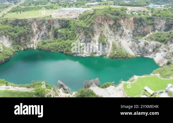 Grand Canyon Chonburi. Trucks dig coal mining of ore with black grunge ...