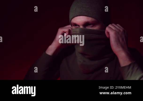 portrait of young serious male ukraine soldier taking on tactical face ...