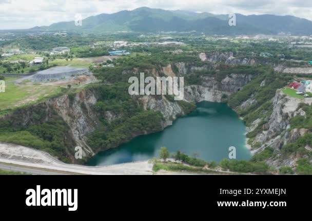 Grand Canyon Chonburi. Trucks dig coal mining of ore with black grunge ...