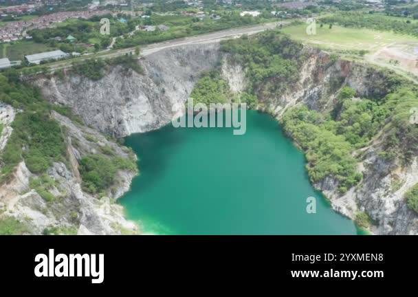 Grand Canyon Chonburi. Trucks dig coal mining of ore with black grunge ...
