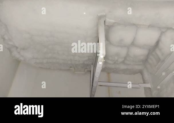 the process of melting the ice in the refrigerator freezer Stock Video ...